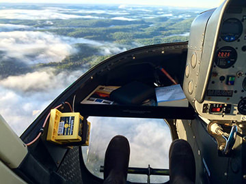 Ashley Fleury patrolling in a helicopter - Pembroke Campus